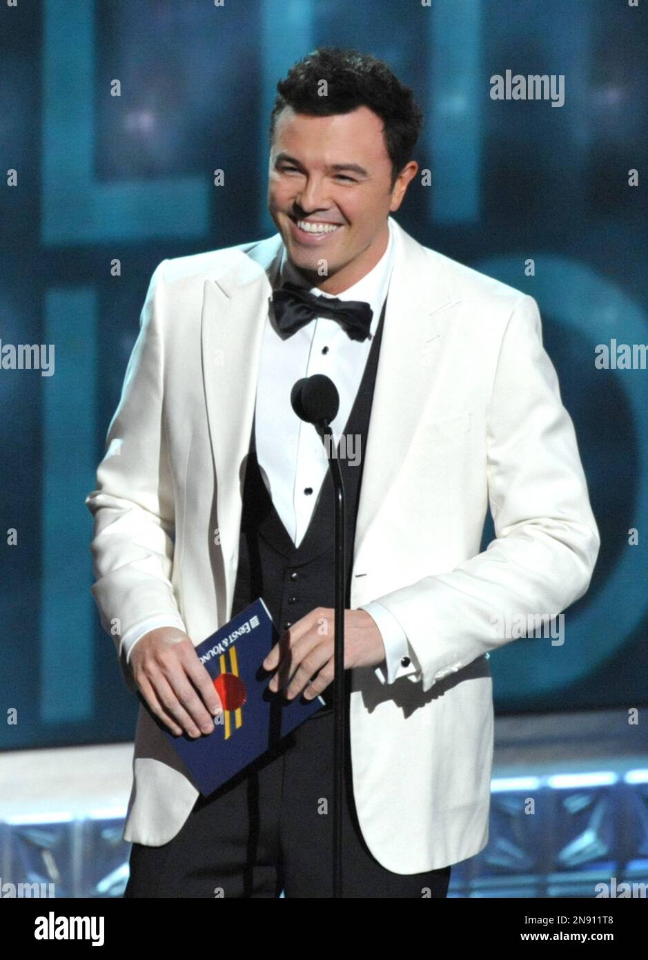 Seth MacFarlane presents an award onstage at the 64th Primetime Emmy ...