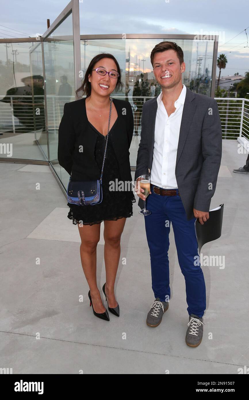 From left, Gallery Director Jennifer Loh and Rob Teeters pose in front ...