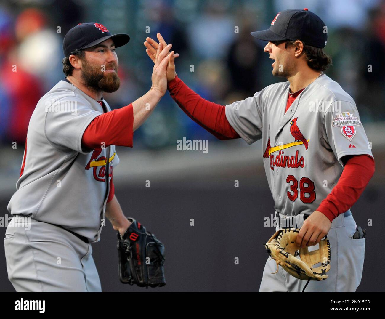 St. Louis Cardinals closing pitcher Jason Motte left, celebrates with ...