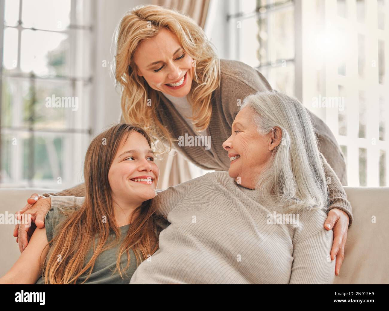 Three generations in one picture. a family relaxing together at home ...