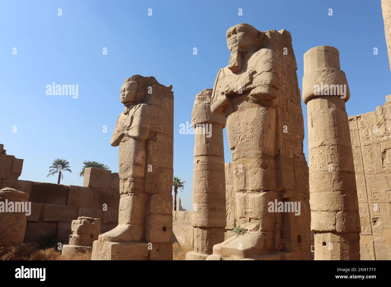 Ancient egyptian statues at Karnak temple in Luxor, Egypt Stock Photo ...