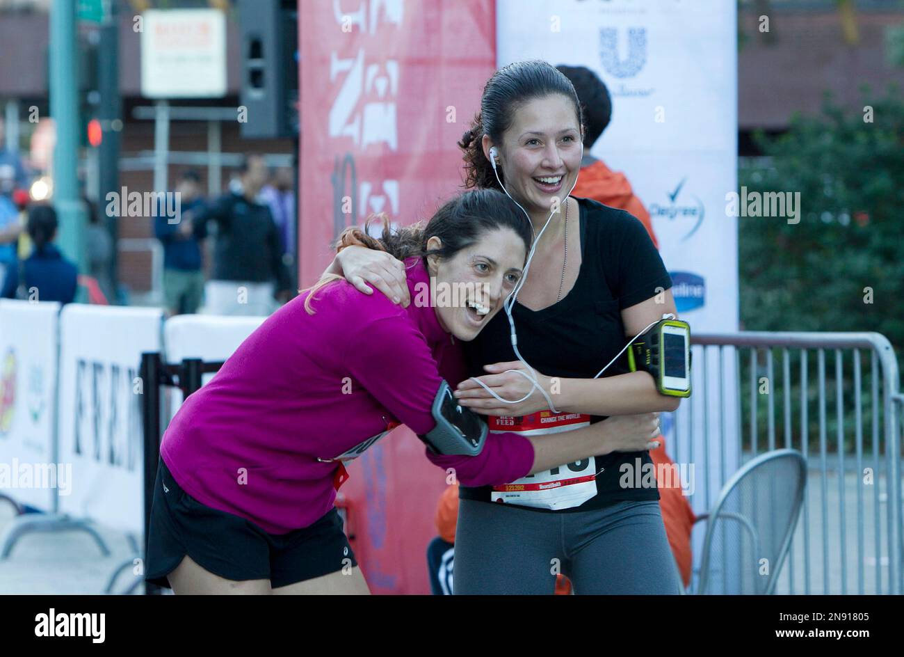 Runners cross the finish line at the flagship 10K event of the ...