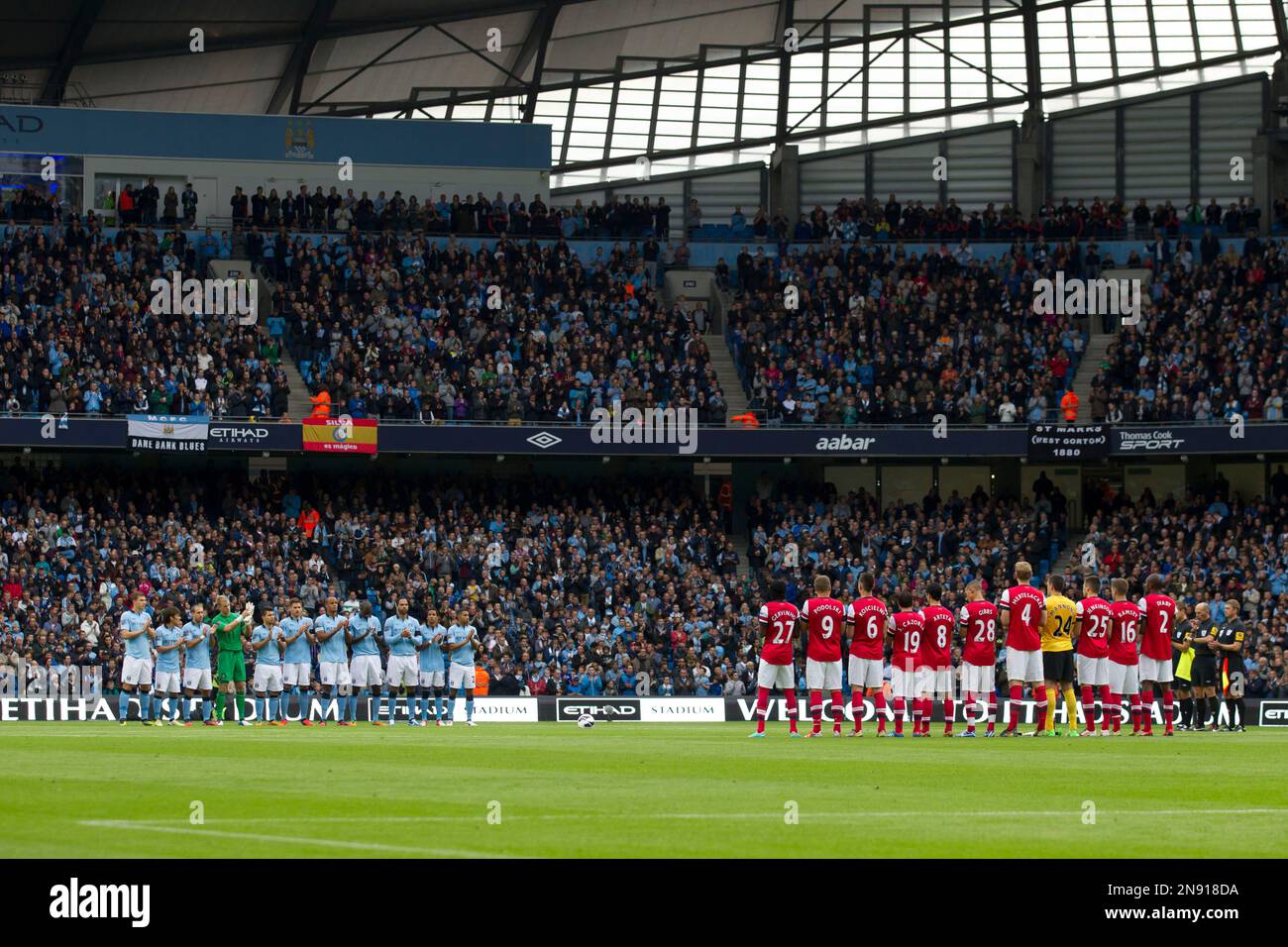 Manchester City and Arsenal players take part in a tribute to ...