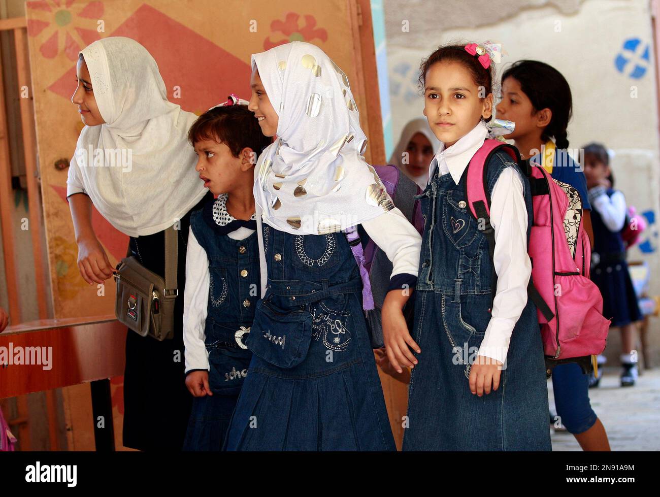 Iraqi children leave their classroom, in the Sadr City neighborhood of ...