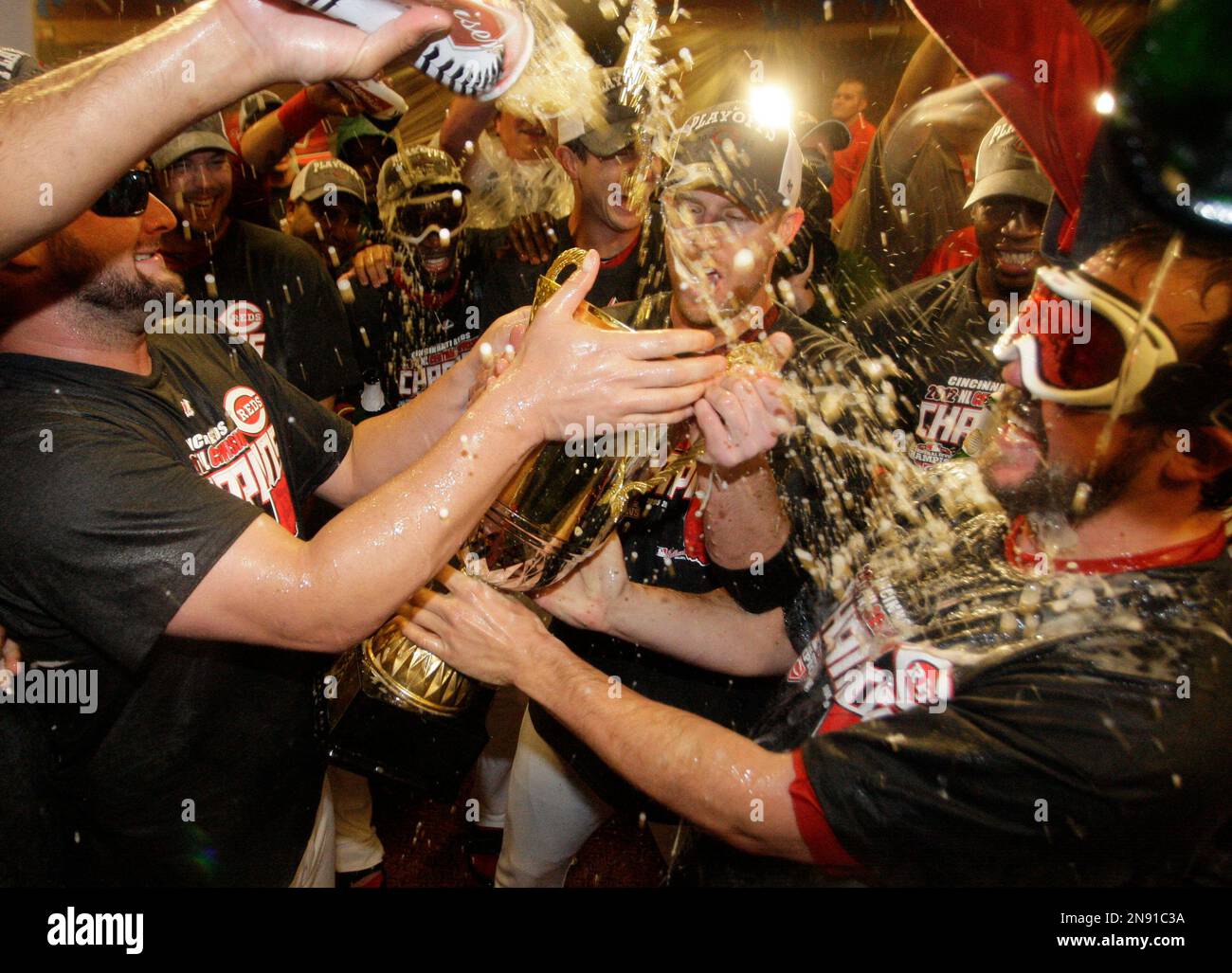 Cincinnati Reds players celebrate in the locker room after they ...