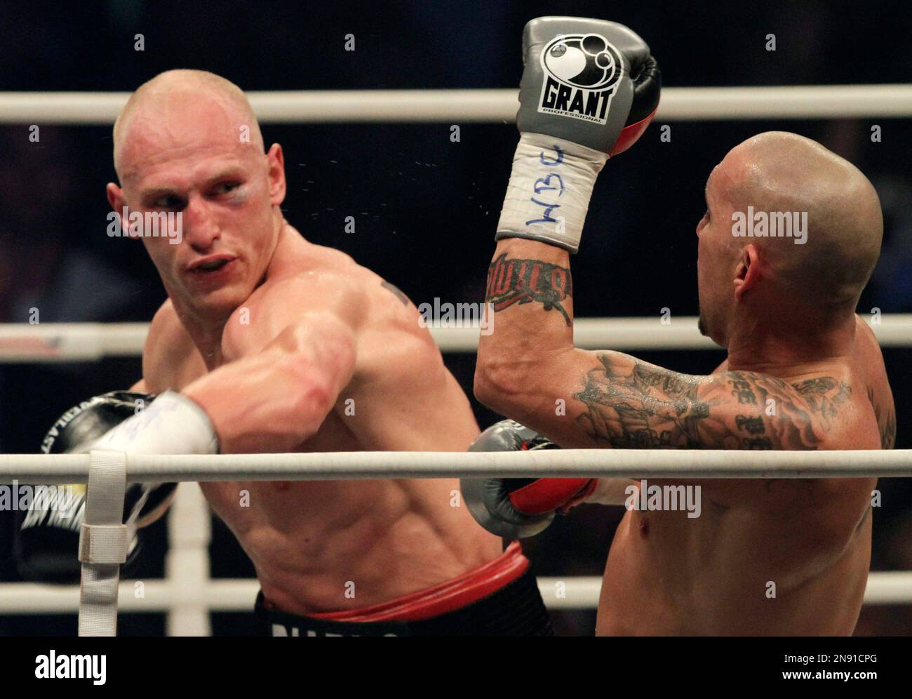 Poland's Krzysztof Wlodarczyk, left, and Francisco Palacios of Puerto ...