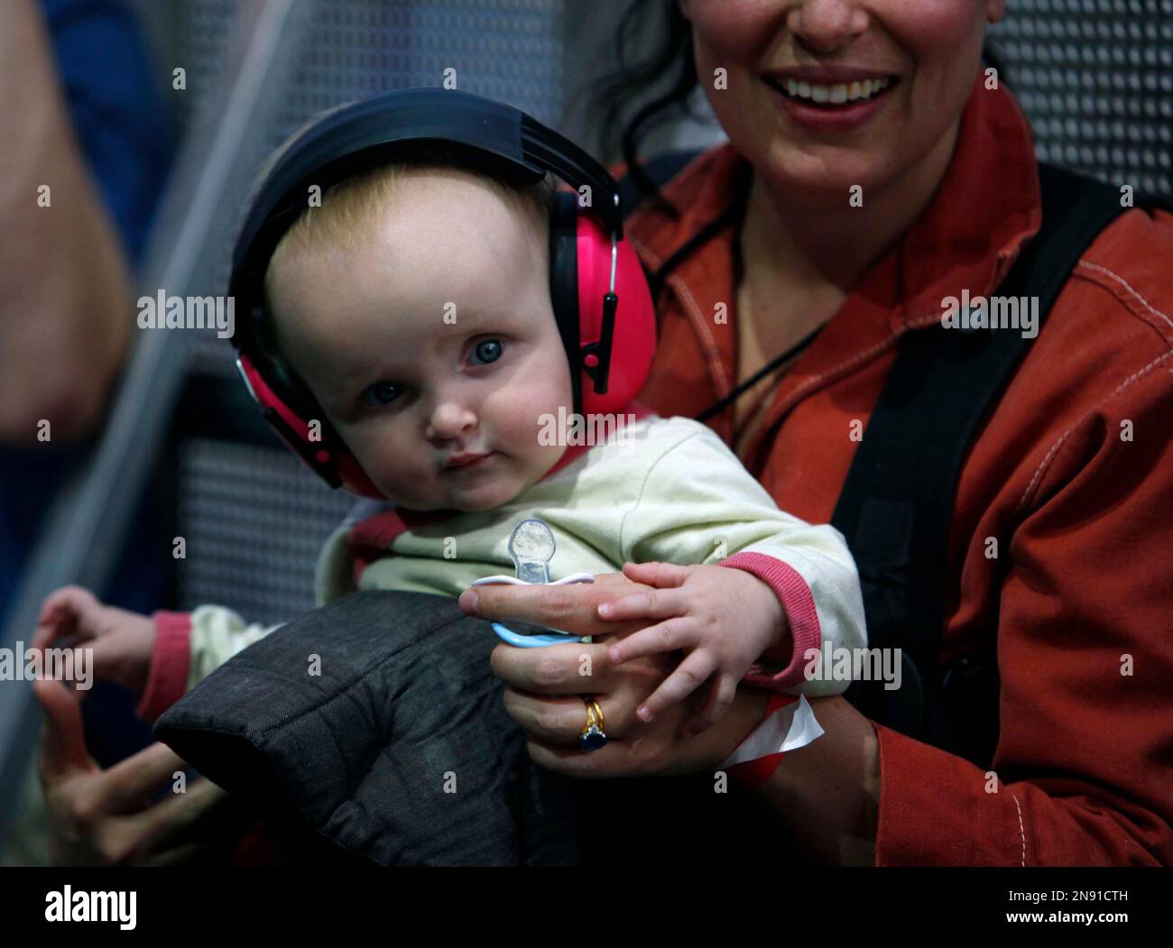 Anna Vinton, from Brooklyn N.Y., wears headphones as she and her mom ...