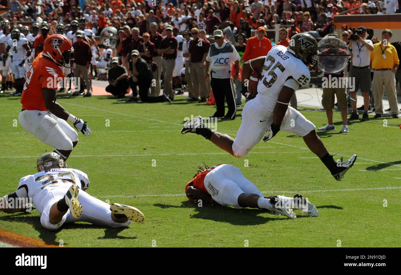 Virginia Tech tailback Martin Scales (25) hurdles Bowling Green ...