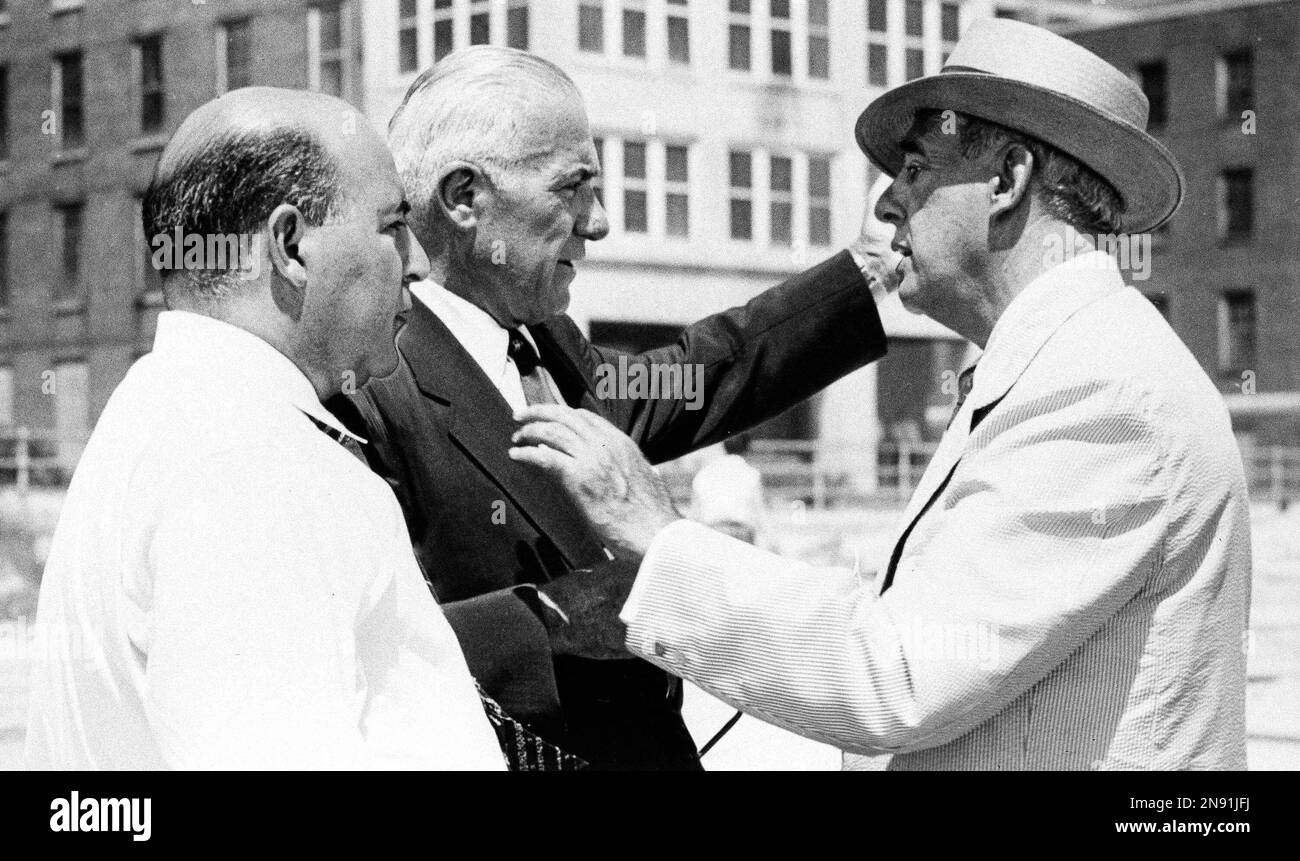 Robert Moses, right, confers with City Comptroller Lawrence Gerosa ...