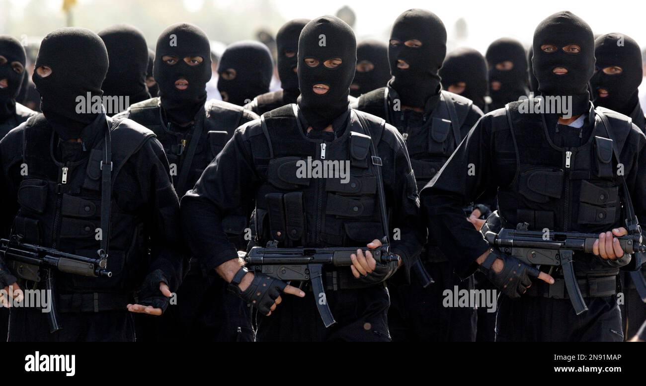 Masked Iranian army troops march in a military parade commemorating the ...