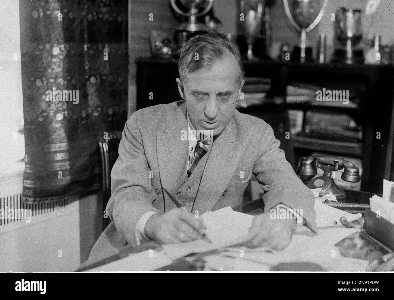 U.S. Marines Brig. Gen. Smedley Butler is shown writing at his desk at ...