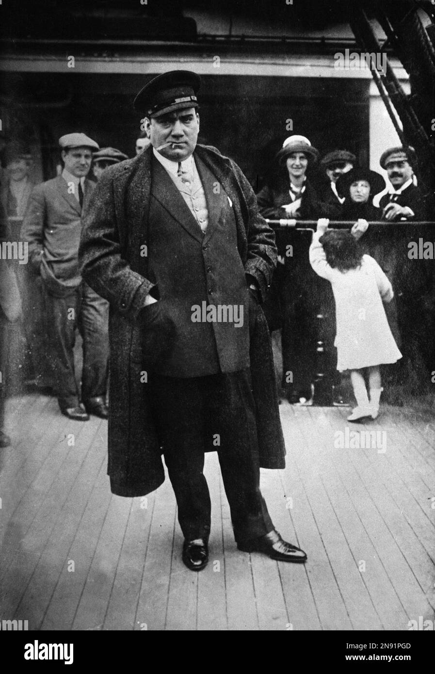 Opera tenor Enrico Caruso is shown on a ship, date and location unknown ...