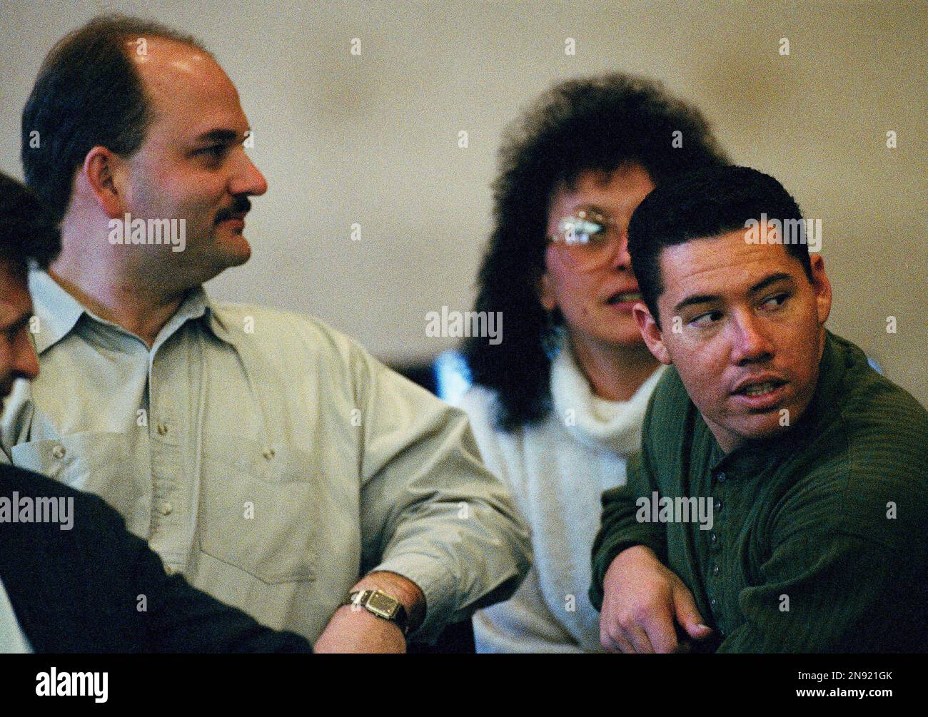 Derrick Smith and Shane Stant wait for a Court apearance as they sit in ...