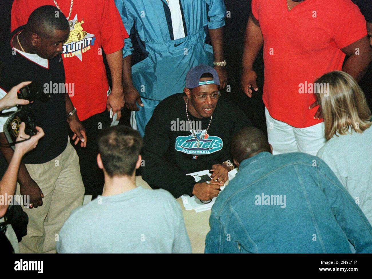 Percy Miller draws a crowd during an autograph session after a ...
