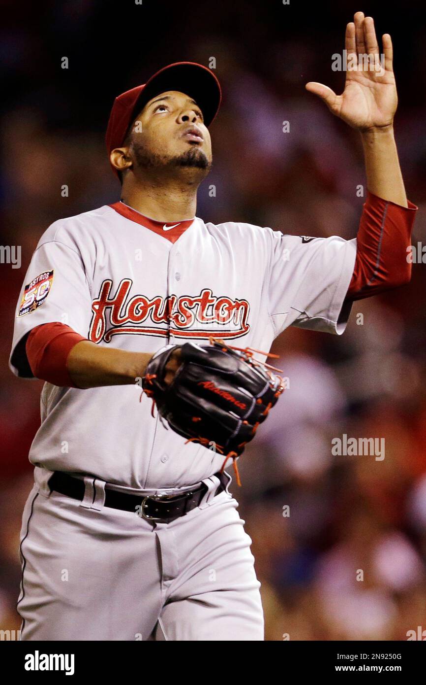 Houston Astros' Fernando Abad looks skyward as he walks off the field ...