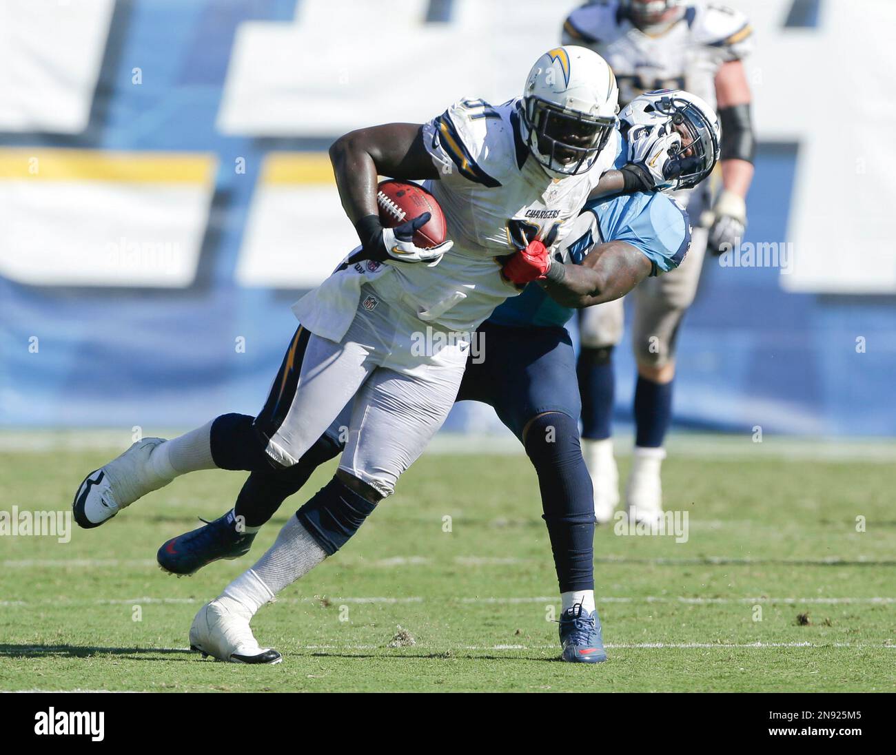 San Diego Chargers tight end Randy McMichael straights arms a Tennessee ...