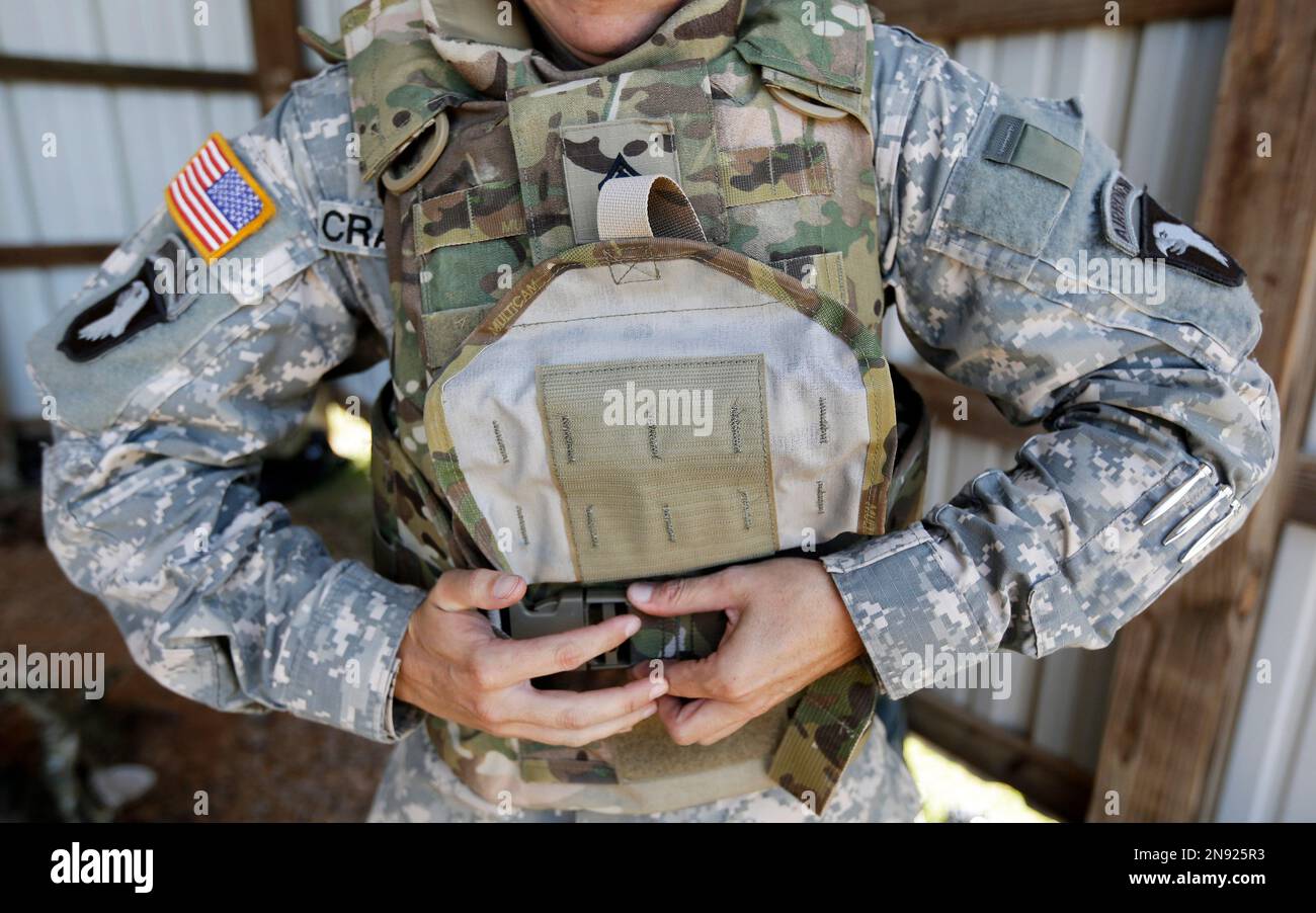 Sgt. Bobbie Crawford removes her new body armor after training on a ...