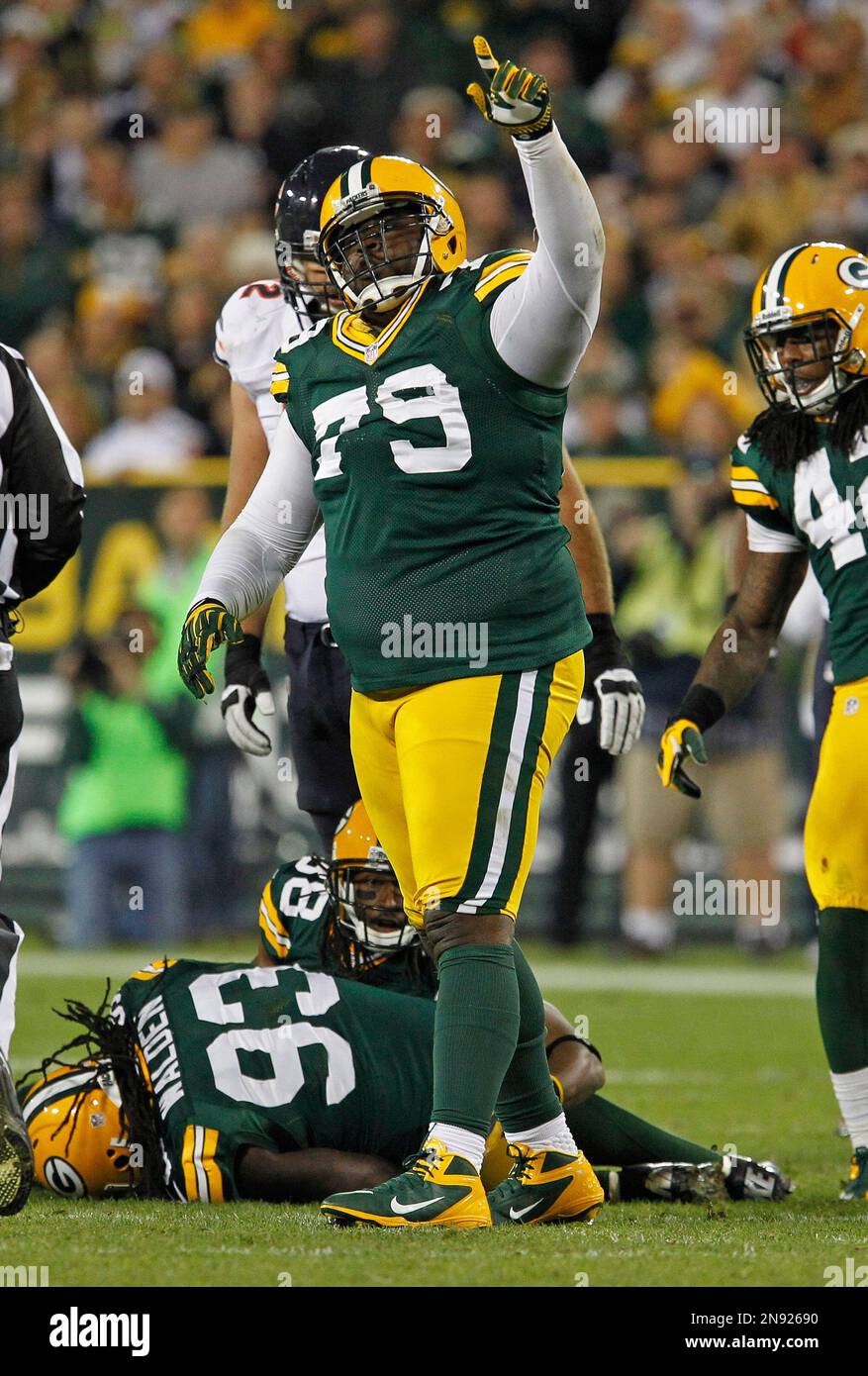 Green Bay Packers defensive end Ryan Pickett celebrates after a play ...