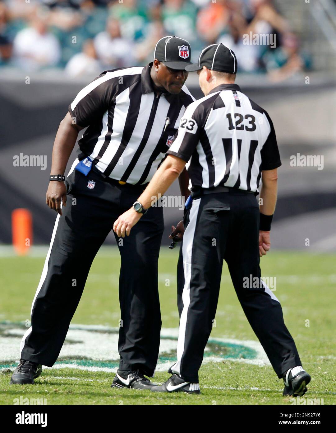 Officials talk on the field in the second half of an NFL football game ...