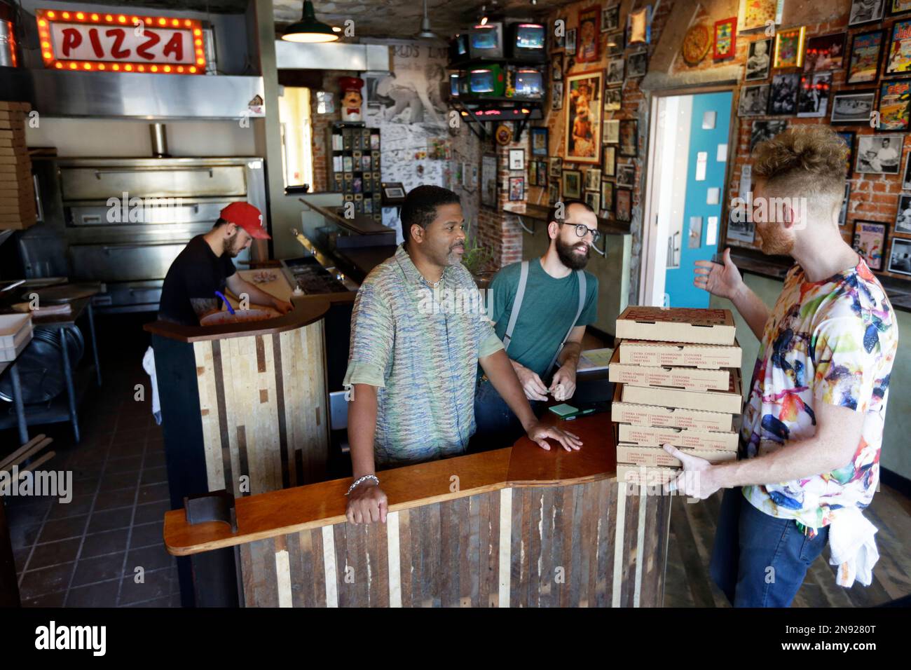 In this Wednesday, Sept. 12, 2012 photo, the owners of Pizza Brain ...