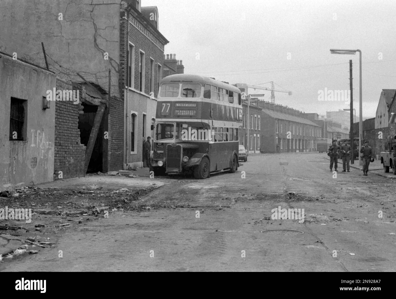 British soldiers patrol a street in Falls Road area, of Belfast, on ...