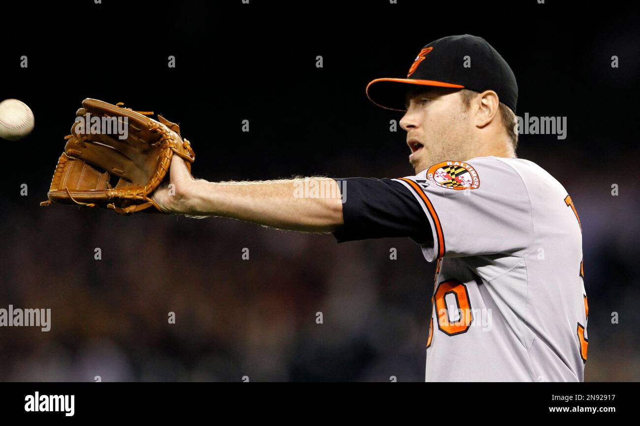 Baltimore Orioles starting pitcher Chris Tillman gets the ball back ...
