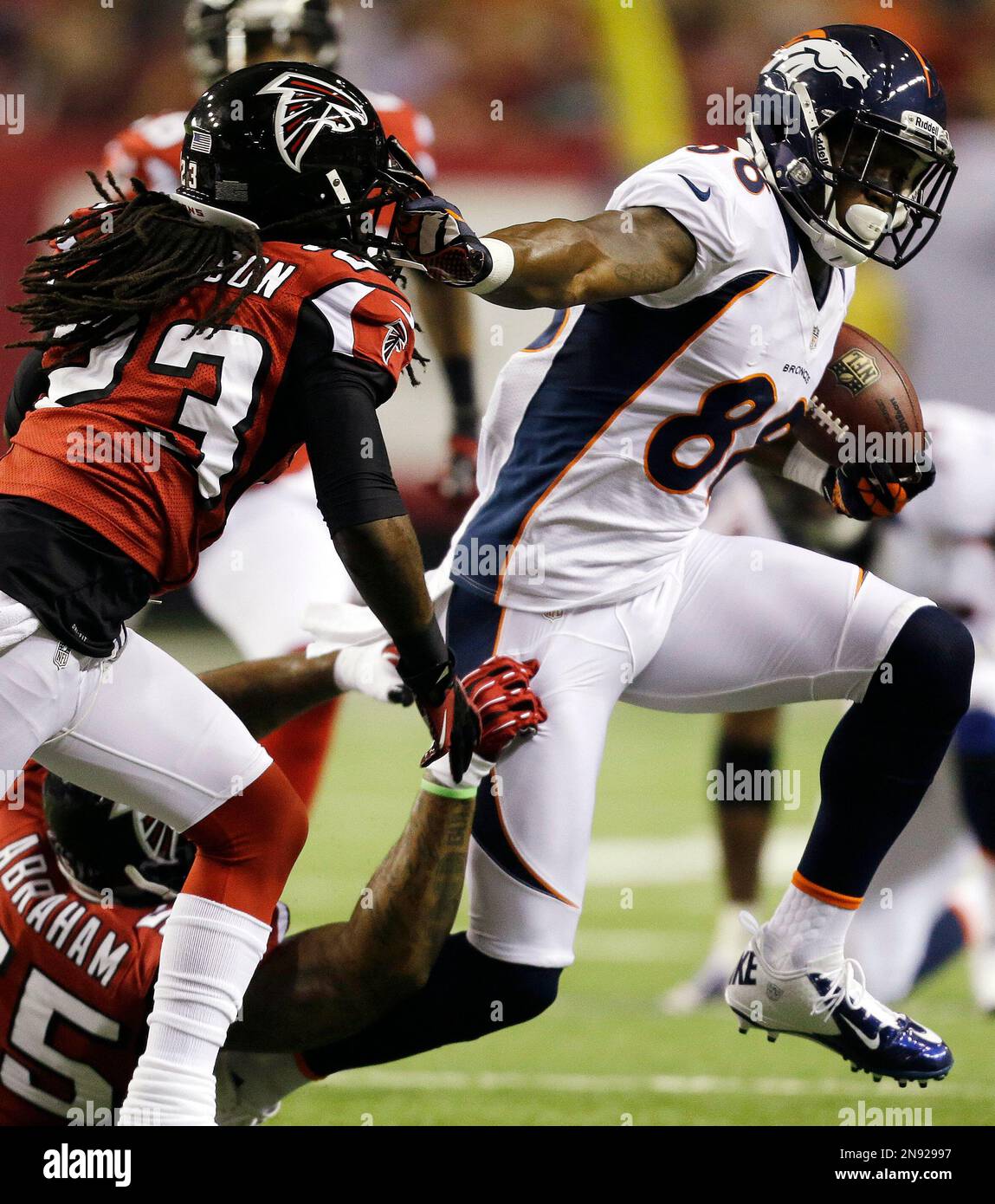 Denver Broncos wide receiver Demaryius Thomas (88) fends off a tackle ...