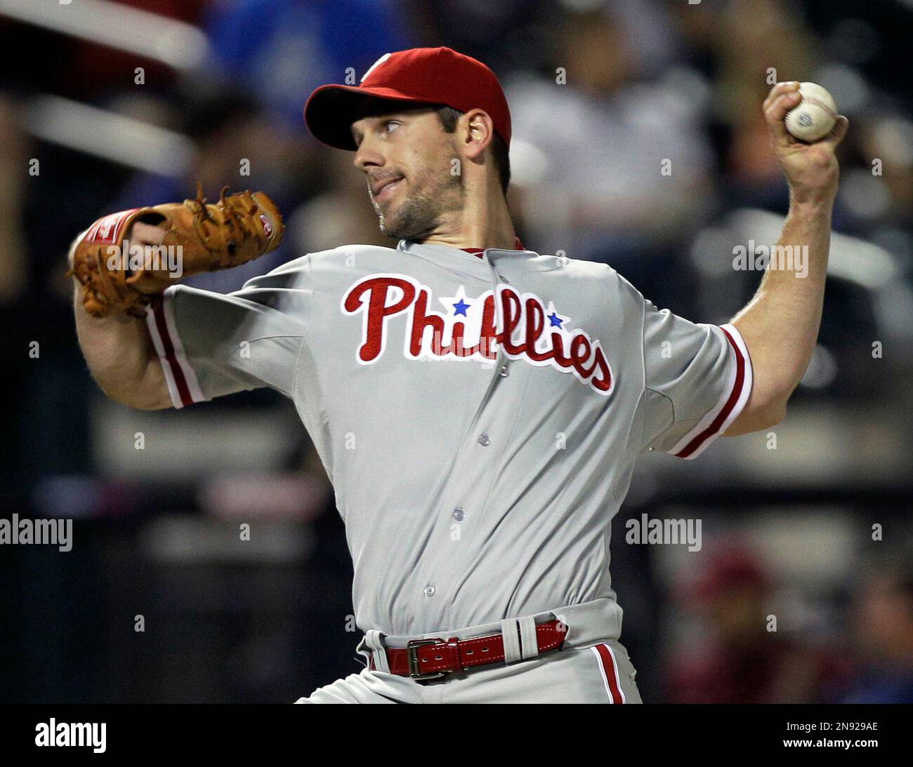 Philadelphia Phillies starting pitcher Cliff Lee winds up against the ...