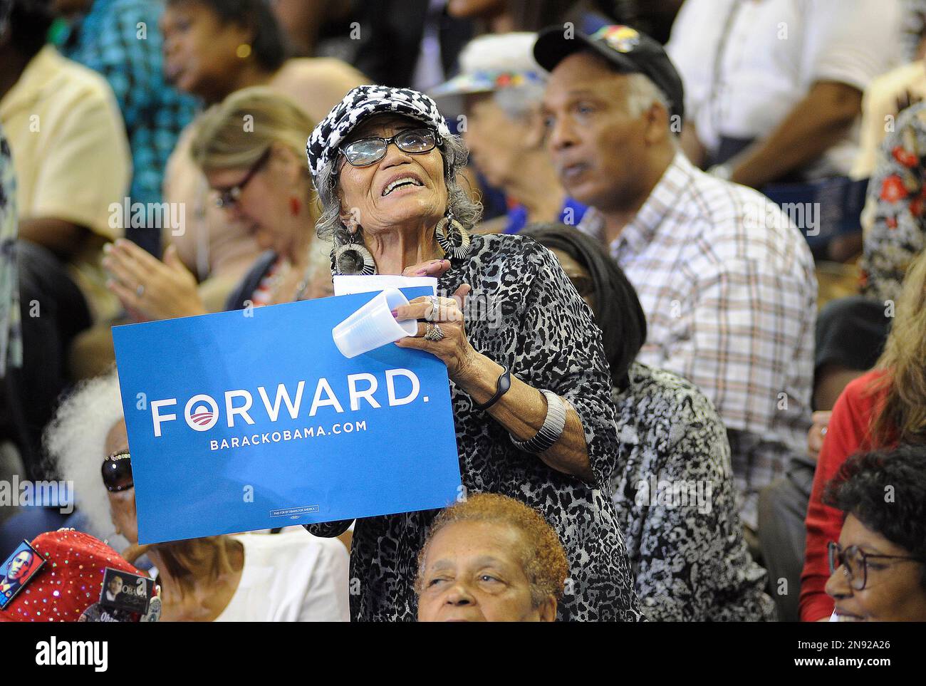 An elderly lady joins in with students at the University of Florida as ...