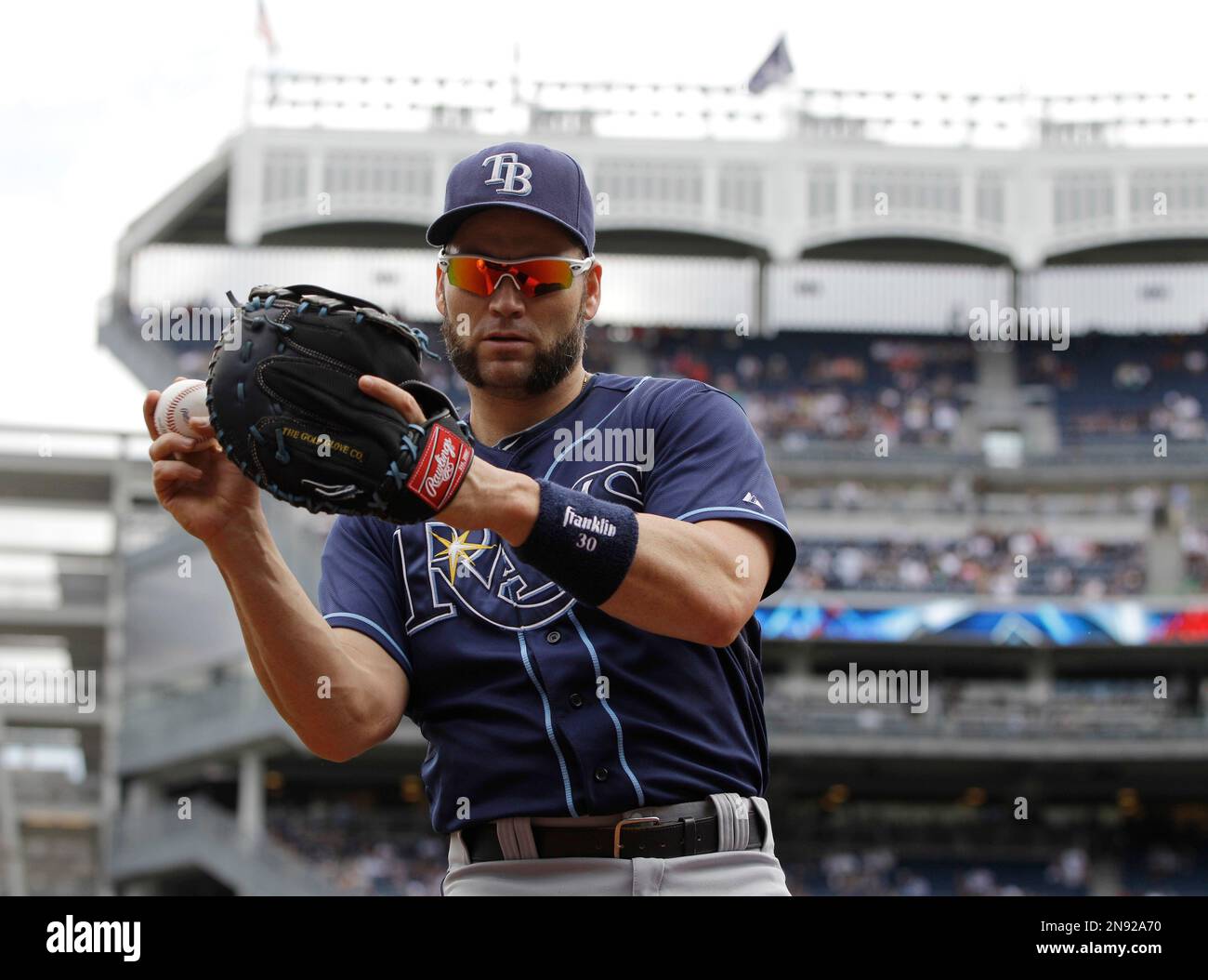 Tampa Bay Rays Luke Scott throws on the field to warm up before the ...