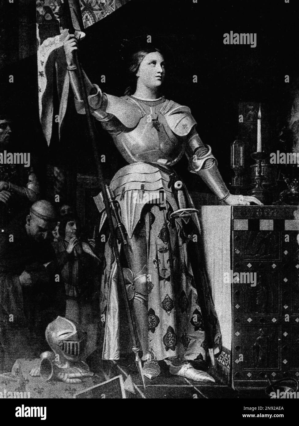 Joan of Arc, a national heroine of France, is shown wearing armor. Joan ...