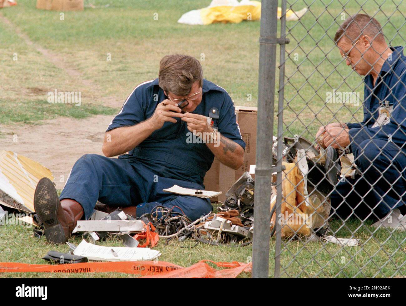 An investigator with the National Transportation safety Board uses a ...