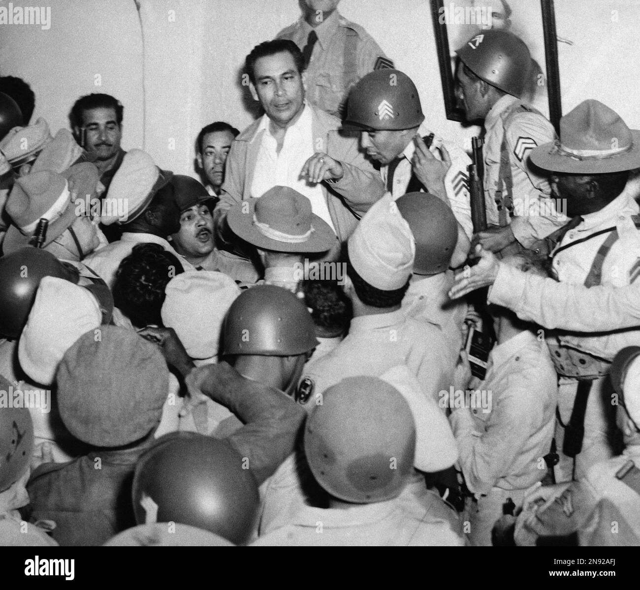 Gen. Fulgencio Batista (white shirt, tieless), who led successful ...