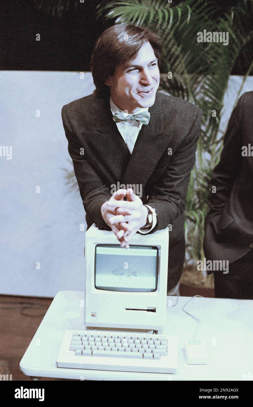 Steve Jobs, Chairman of the board of Apple Computers, poses with Apple ...