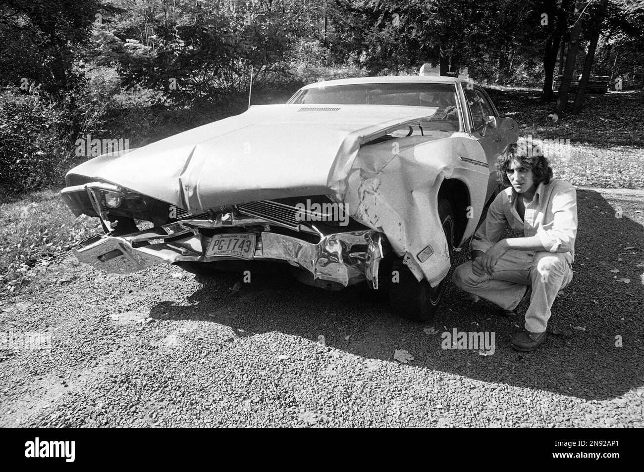 James Salamites, 19, with his car in Meriden, Connecticut on Thursday ...