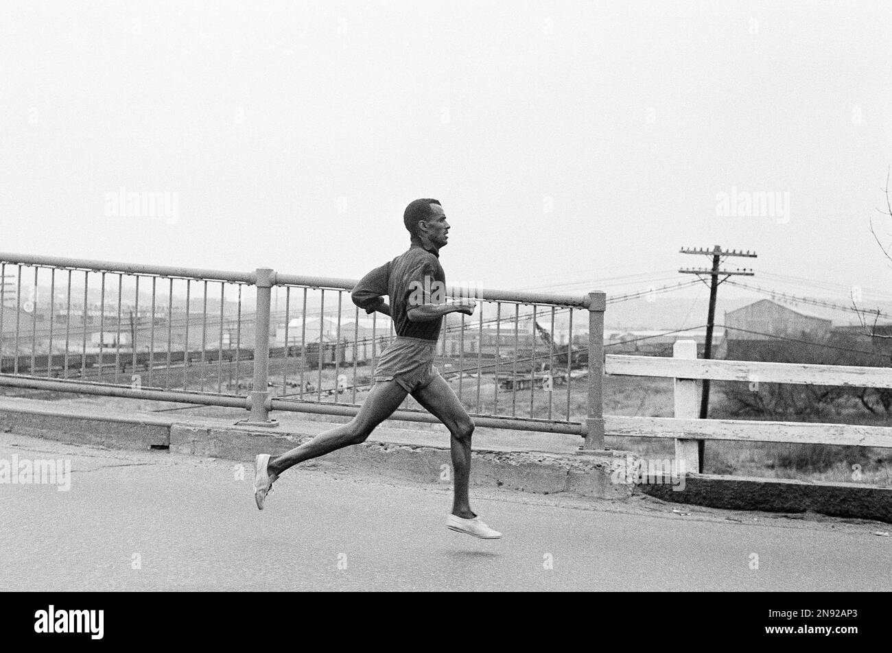 Ethiopian runner Mamo Wolde is shown competing in 12 mile road race ...