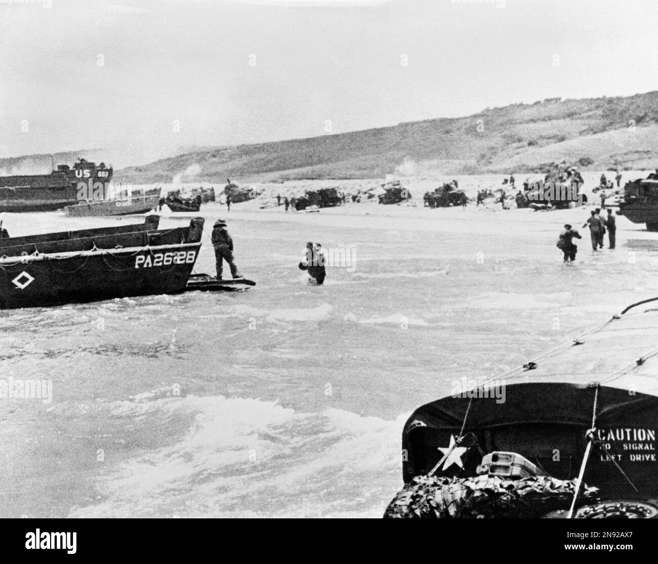 Allied tanks in a line on a beach on the Normandy coast Inland against ...