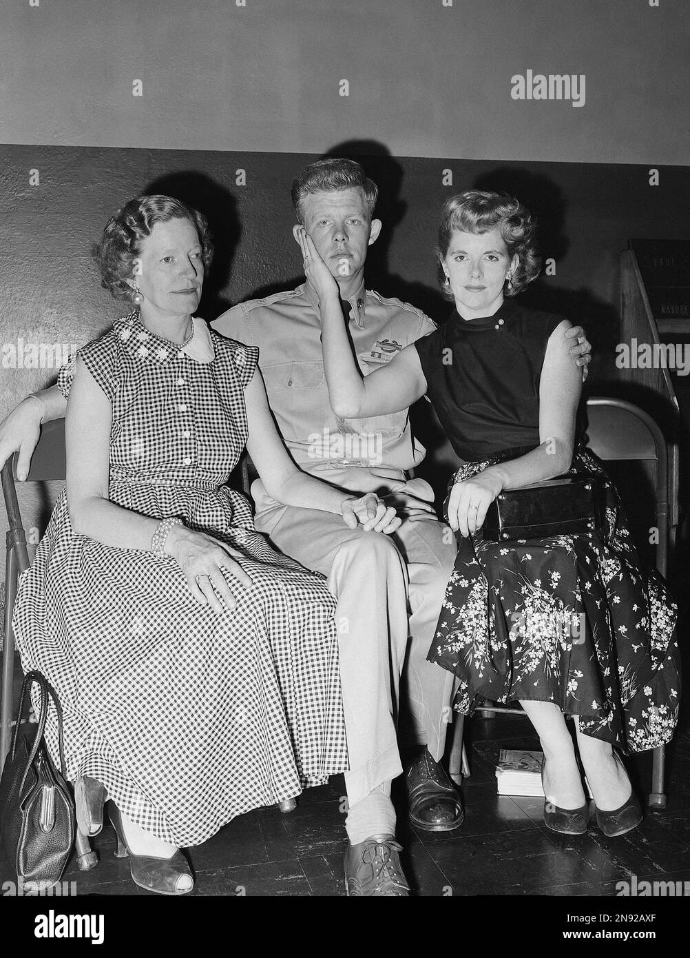 Sgt. James C. Gallagher sits with his mother, left, and his sister, Mrs ...