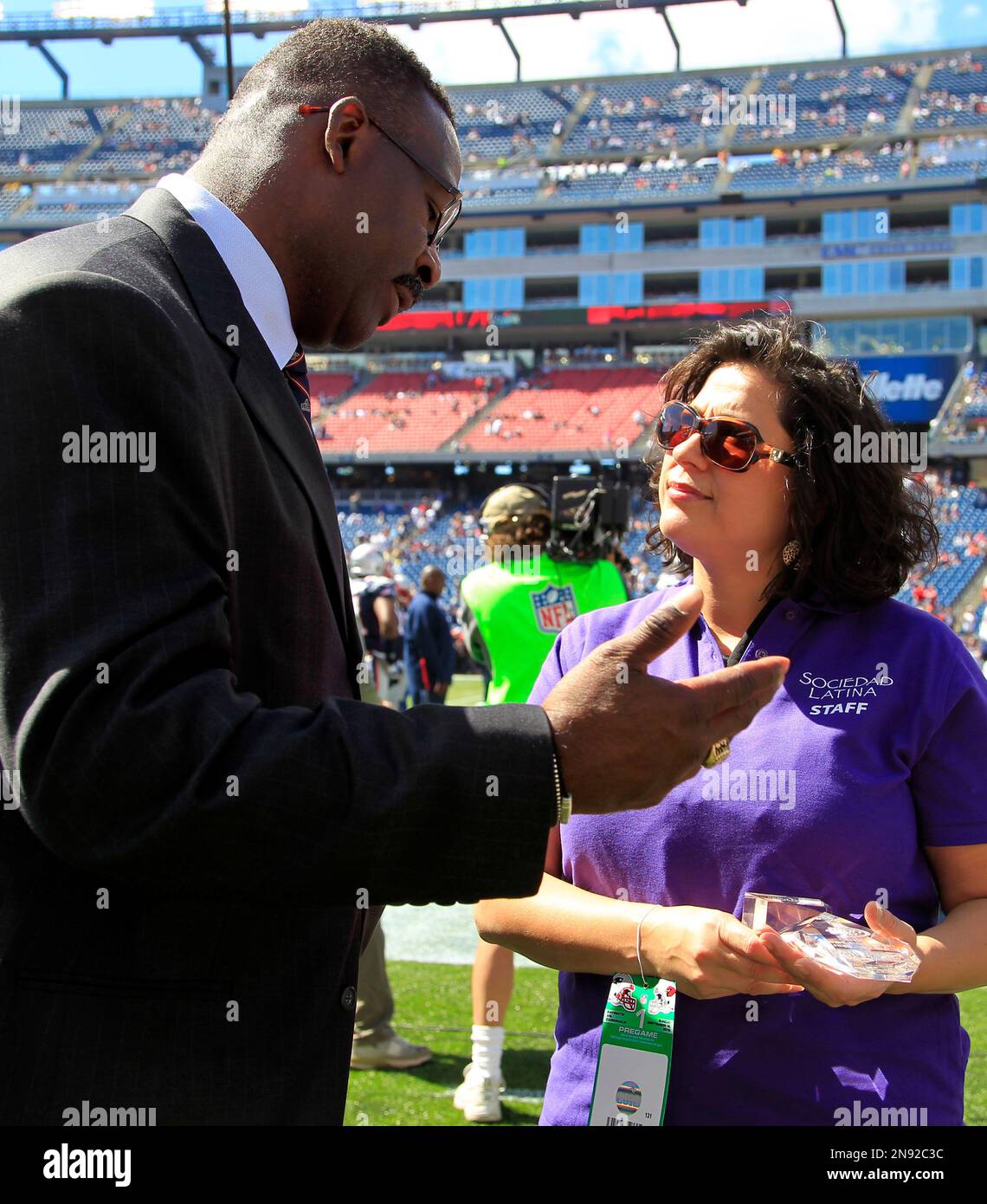 Former New England Patriots linebacker Andre Tippett, left, presents ...