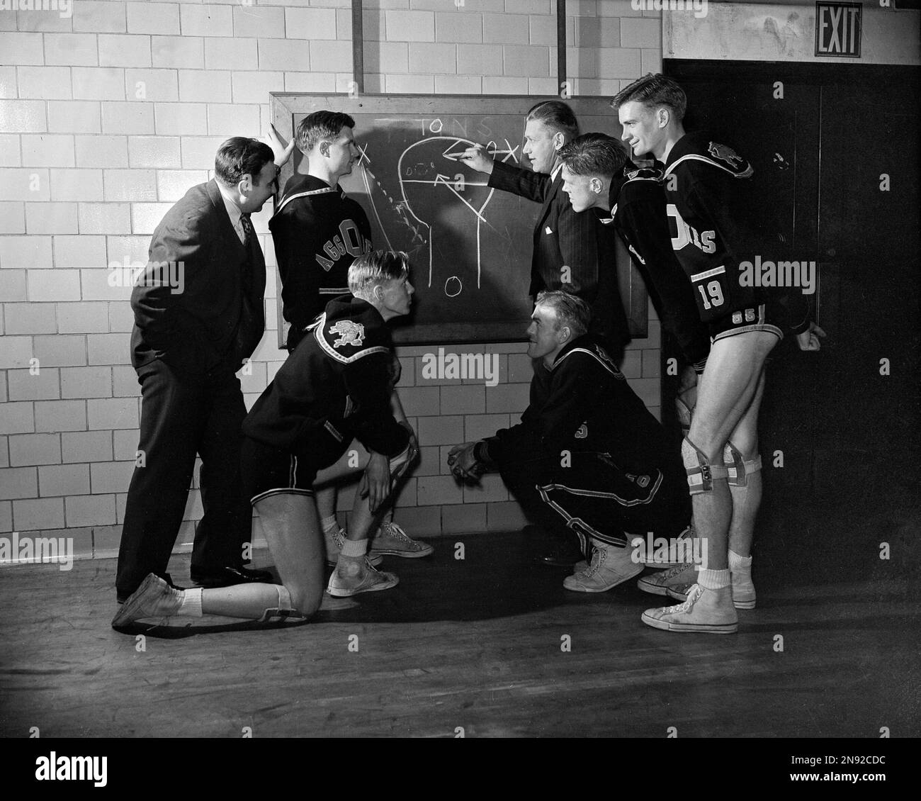 DePaul University basketball coach Ray Meyer, listens in as Oklahoma A ...