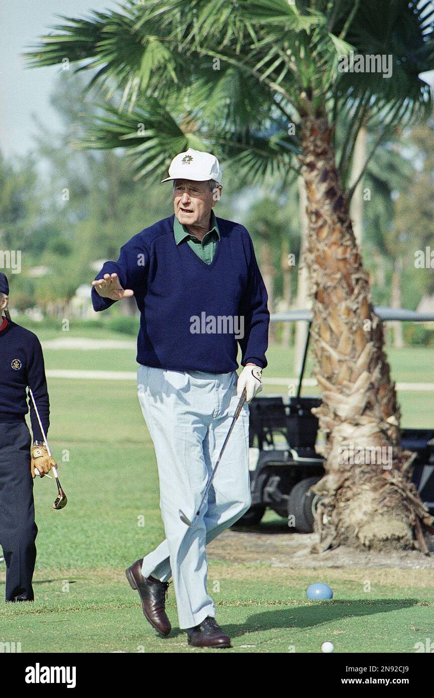 President George Bush waves as he approaches the tee at the Gasparilla ...