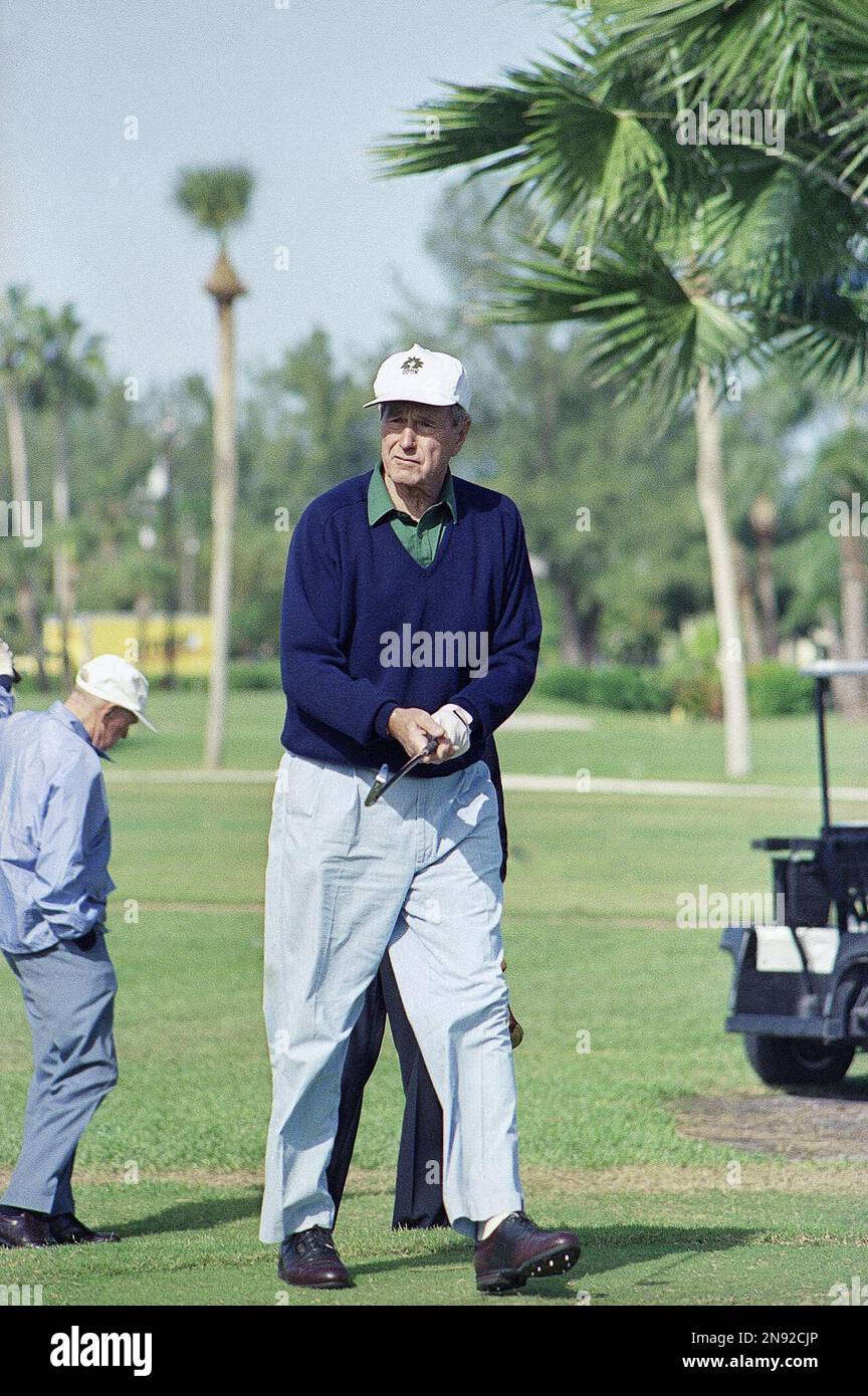 President George Bush waves as he approaches the tee at the Gasparilla ...