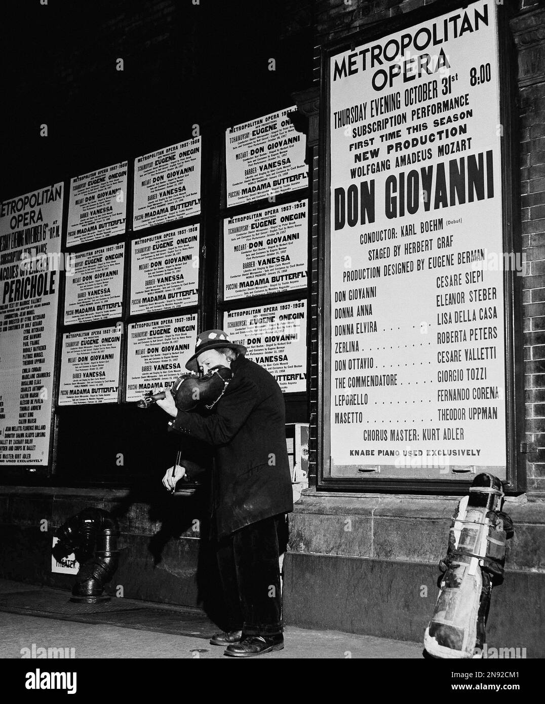 An itinerant violinist plays a lonely tune outside the Metropolitan ...