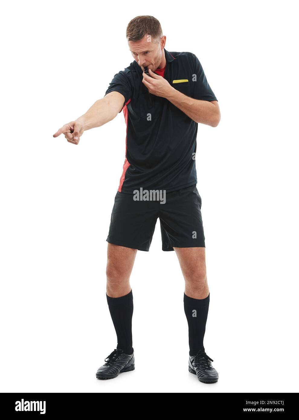 Sports, whistle and male referee in a studio pointing for a soccer game ...