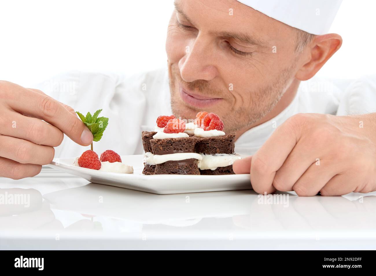 Baking, presentation and chef with cake for dessert isolated on a white ...