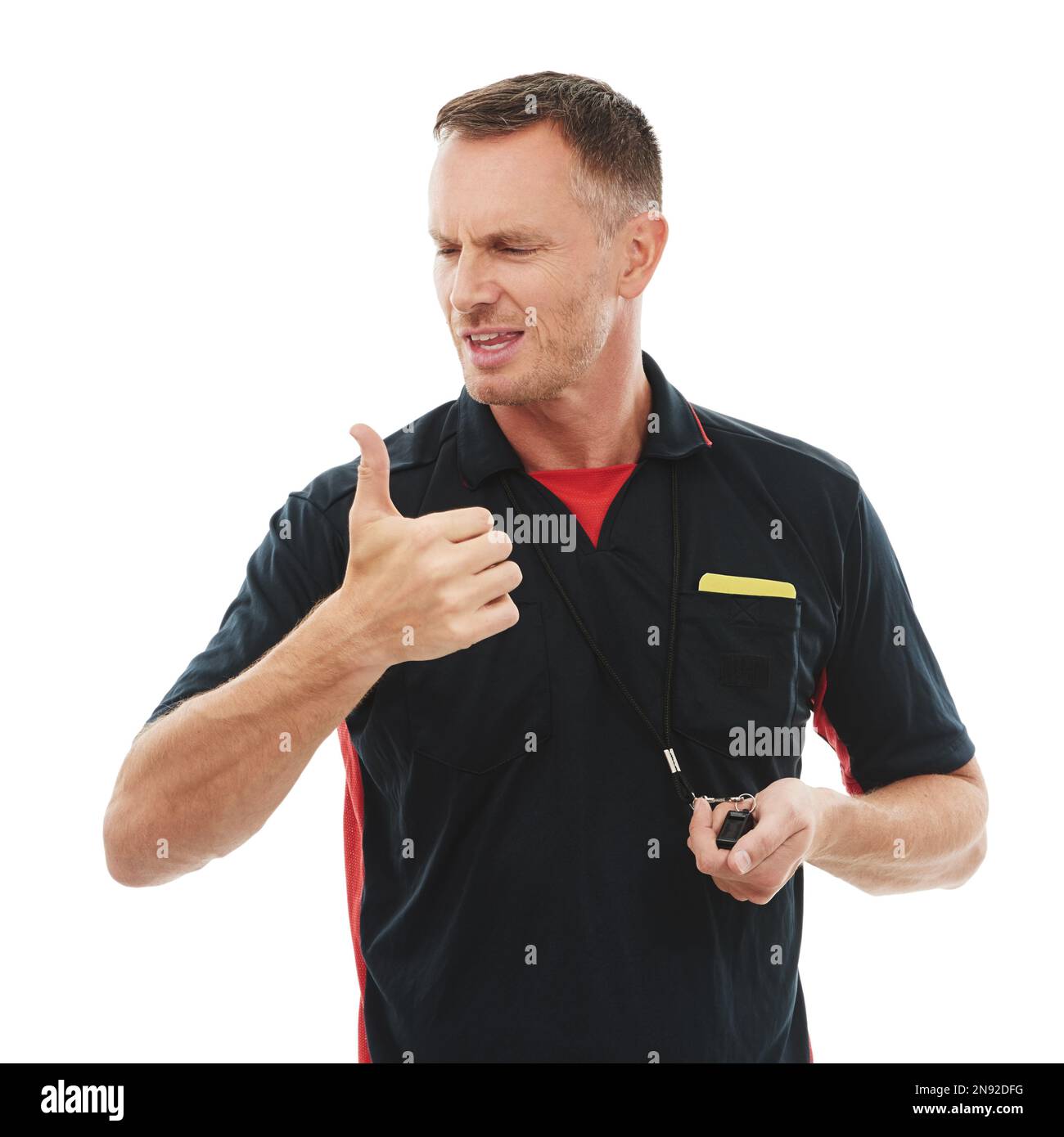 Whistle, thumbs up and male referee in a studio giving instructions ...