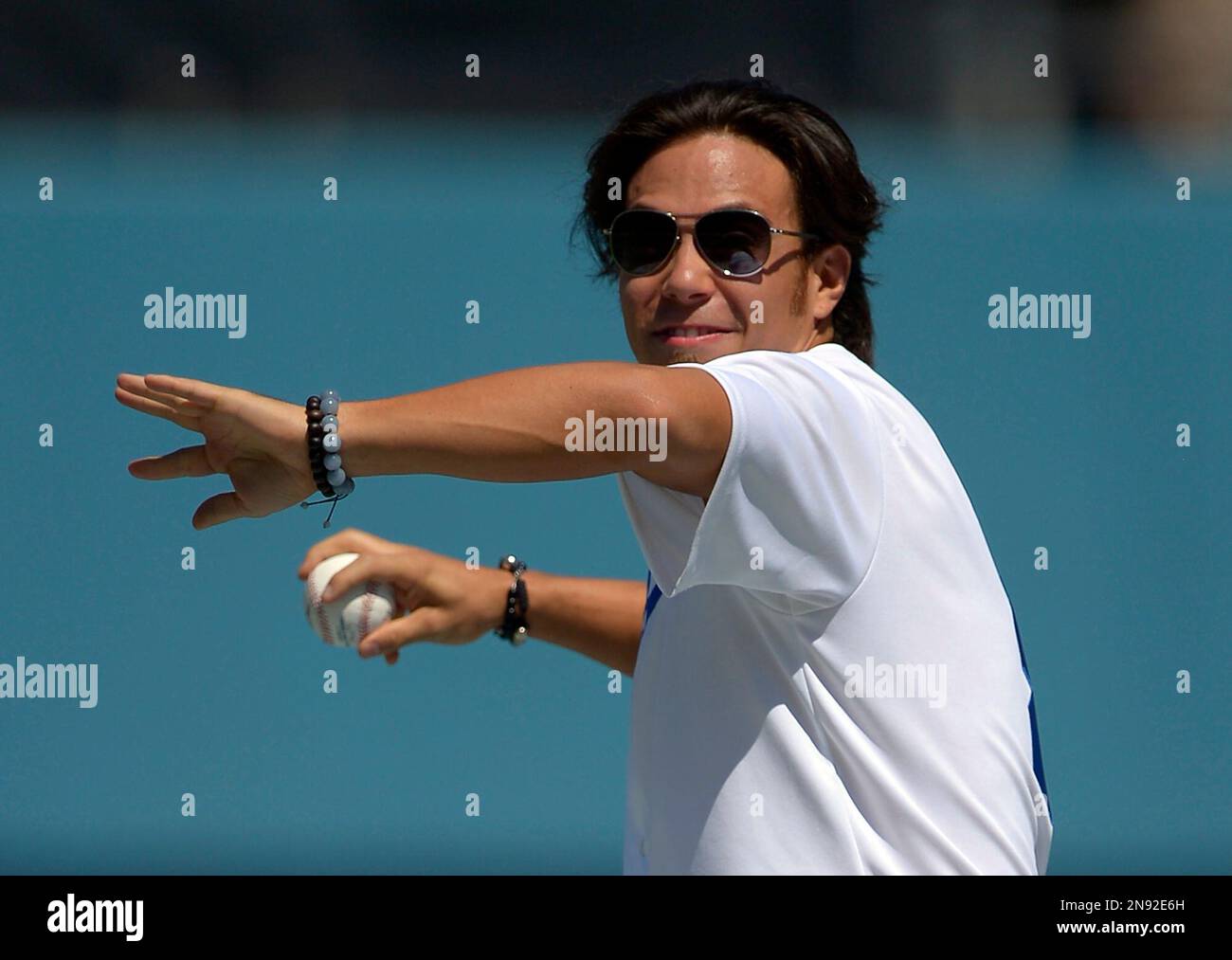 Olympic short track speed skater Apolo Anton Ohno throws out the ...