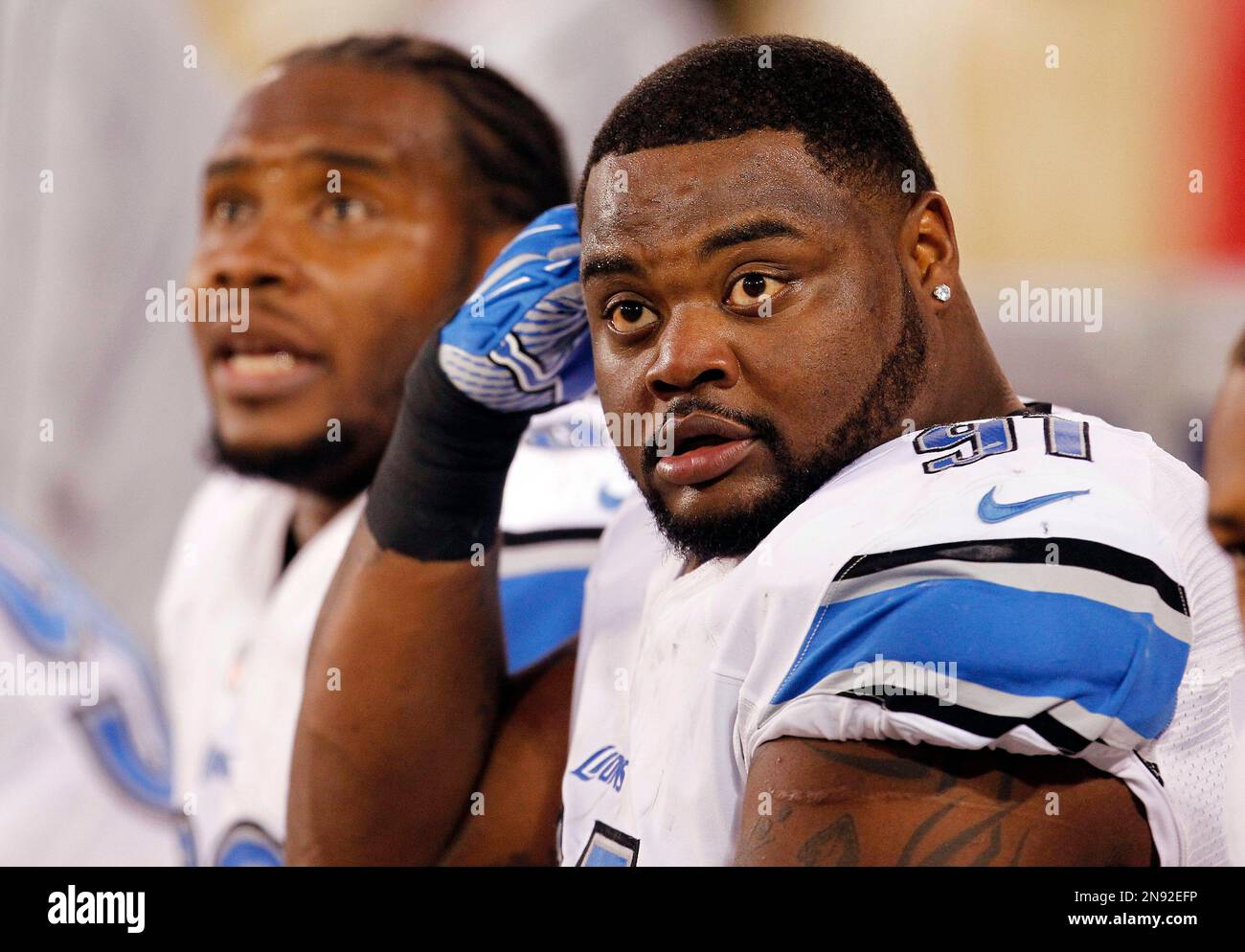 Detroit Lions defensive tackle Corey Williams, left, and defensive end ...