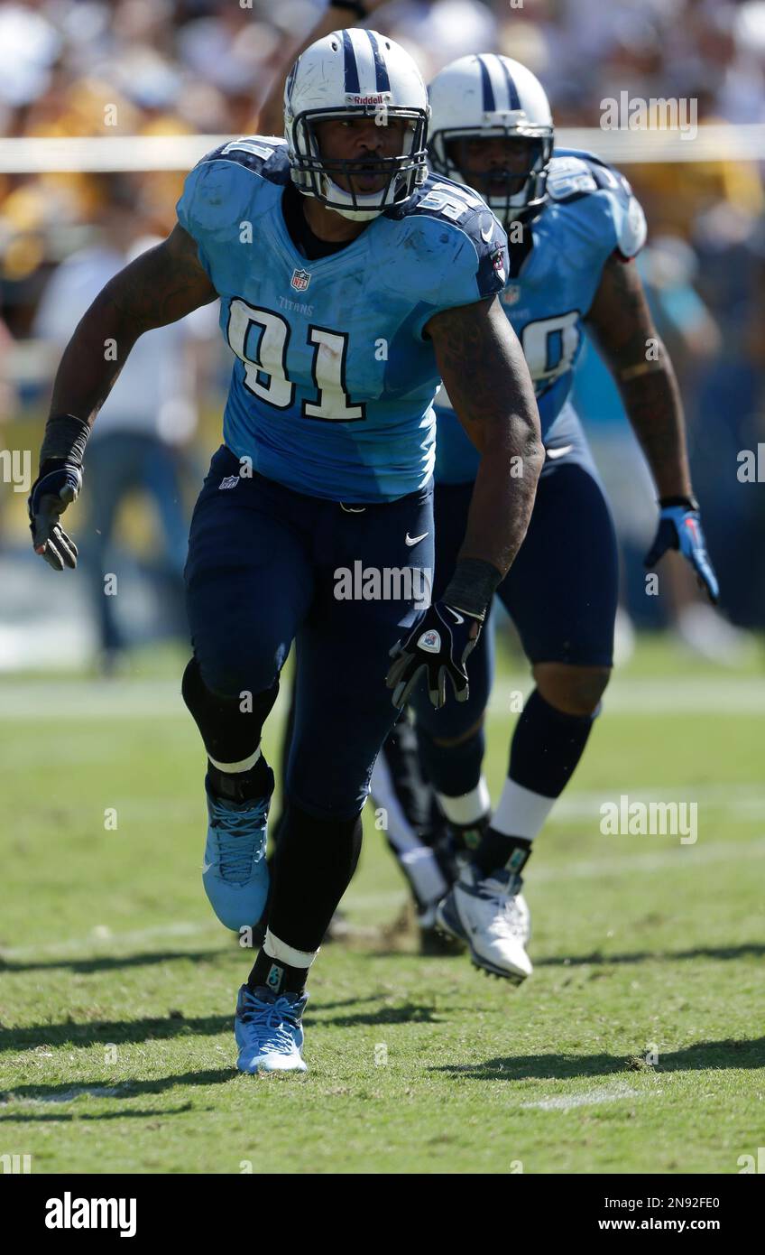Tennessee Titans defensive end Derrick Morgan, front, and teammate ...