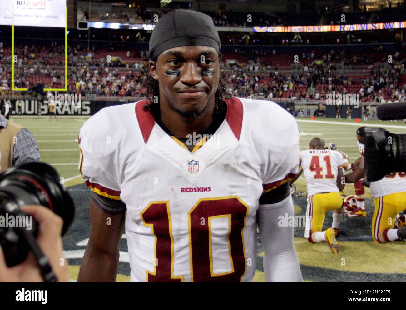 Washington Redskins quarterback Robert Griffin III walks off the field ...